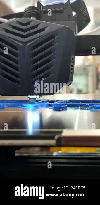 The process of printing on 3D printer. 3D printer printing object from ...