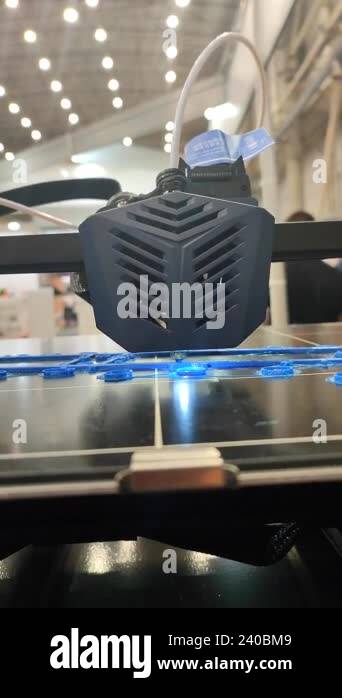 The process of printing on 3D printer. 3D printer printing object from ...