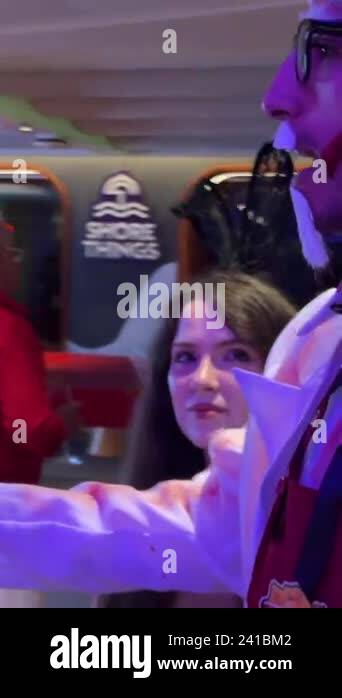 doctor covered in blood man in red inflatable suit looking at camera ...