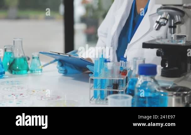 scientist with chemical samples in laboratory Stock Video Footage - Alamy