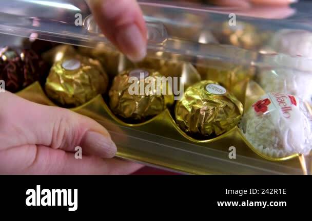 open the box Ferrero collection chocolate products. Ferrero Rocher is ...