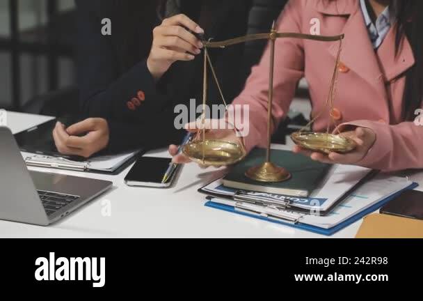 two female lawyer or lawyer discussing the law contract and justice law ...