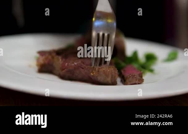 roast beef slices on wooden board. Delicious slices of medium rare ...