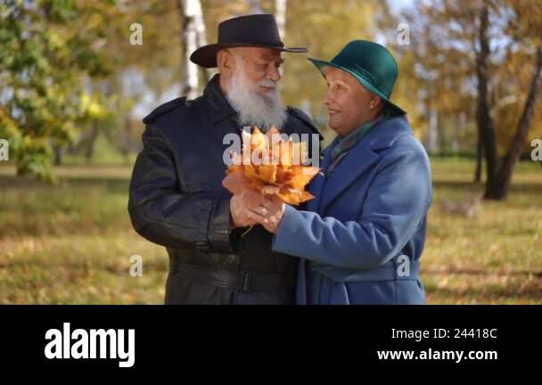 A heartwarming scene of an elderly couple enjoying a tranquil moment in ...