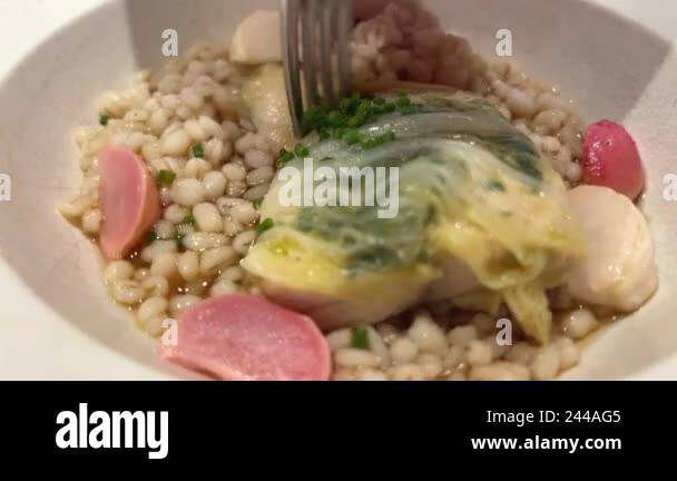 fish in a cabbage leaf white juice of the fish to get with a fork on ...
