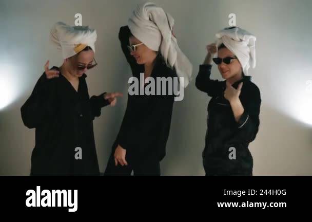 A fun girls night out atmosphere: women in pajamas, glasses and with ...