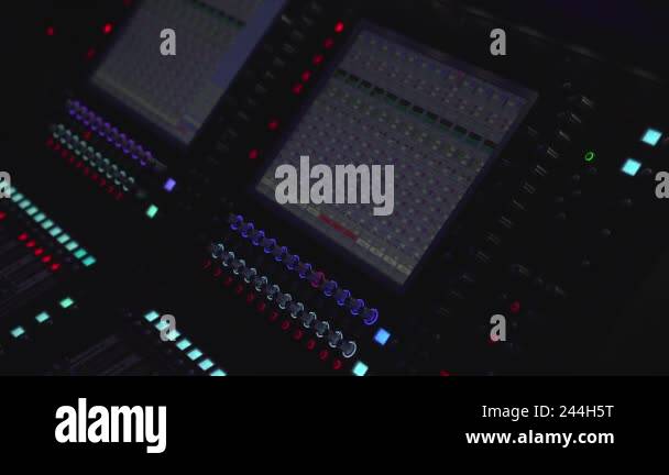 High-tech audio mixing console equipped with digital screens, sliders ...