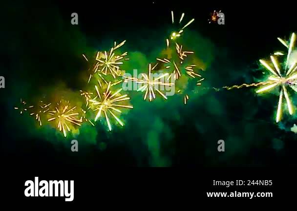 4K. loop seamless of real fireworks background golden shining fireworks ...