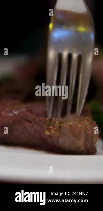 roast beef slices on wooden board. Delicious slices of medium rare ...