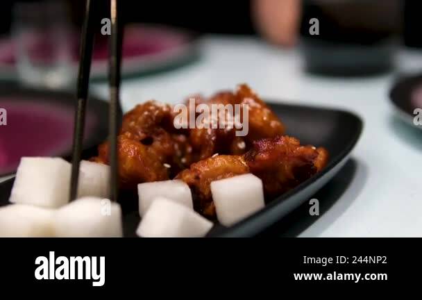 Asia buffet On the plate Asian food sushi in batter chicken fish in the ...
