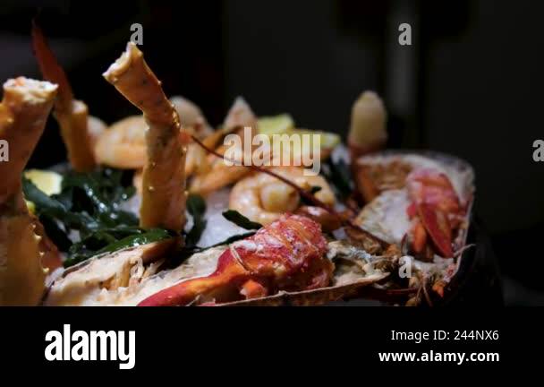 A vibrant display of assorted seafood is showcased, featuring fish ...