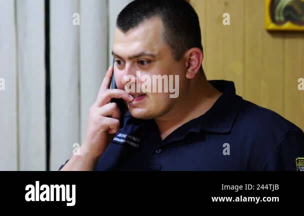 Male firefighter chief have serious telephone conversation with his ...