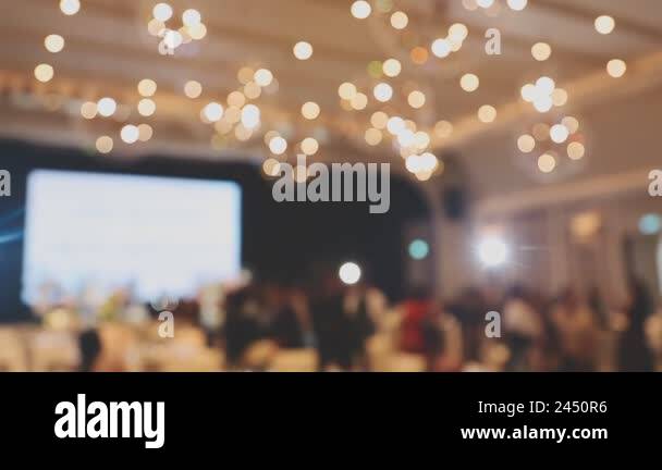 abstract blurred event background with many people at the event for ...