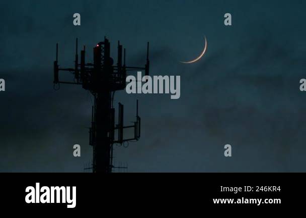 Moon Falling Down Behind A Building Silhouette Stock Video Footage - Alamy