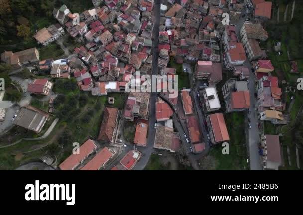 Drone footage shows a picturesque Italian village. The settlement is ...