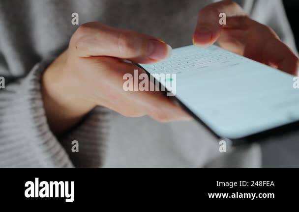 Woman chatting online on smartphone close up, typing text message ...
