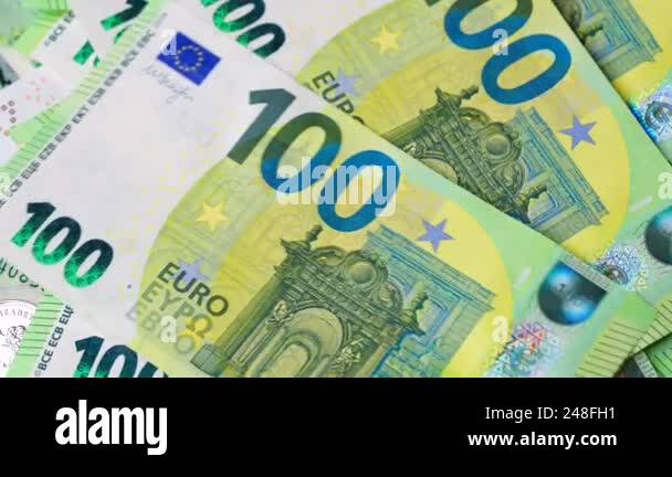 Closeup and detailed view of hundred euro banknotes highlighting its ...