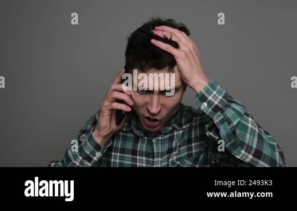 No way, can not be. Shocked guy man shock wonder reading news in phone ...