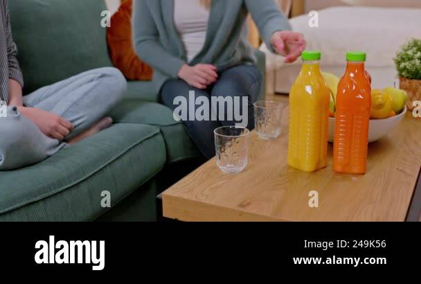 Two friends are enjoying a cozy moment together with vibrant and ...