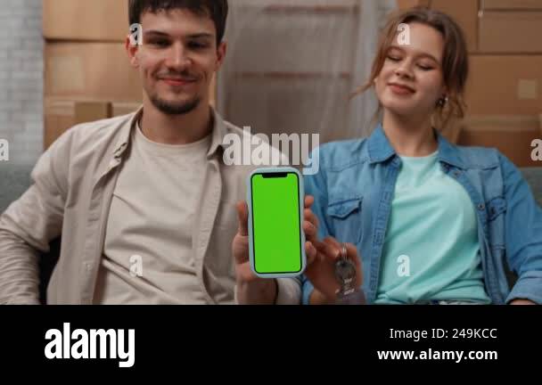 Housewarming concept. Young couple moving into new apartment, space ...