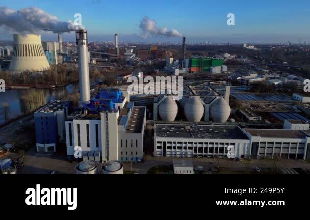 Aerial view of a waste to energy plant emitting smoke from its chimney ...