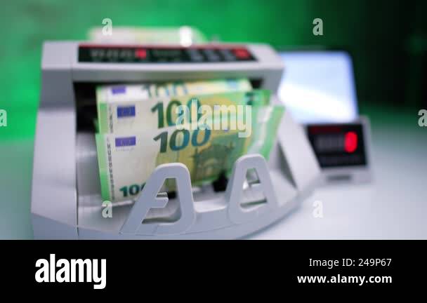 Counting euro banknotes in the cash calculating machine. Close up ...