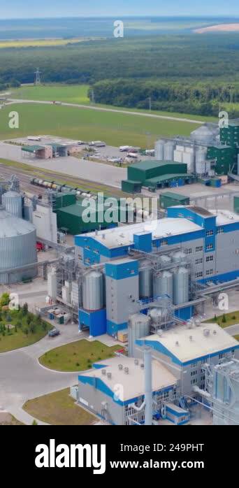 Modern industry surrounded by nature. Grain elevators on large ...