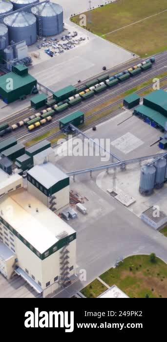 Grain elevators on field. Modern industry for agribusiness. Grain ...