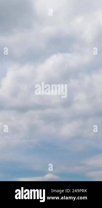 White clouds spreading along the horizon. Cloudscape in the sky on ...