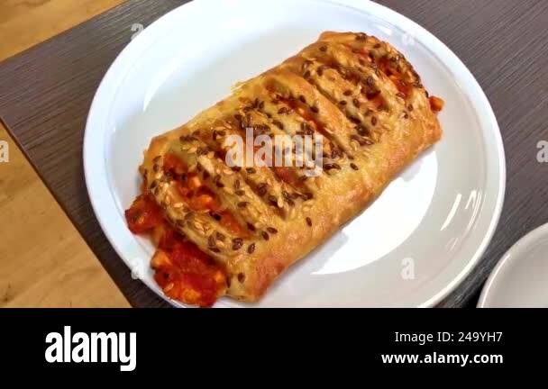 Pastry with tomatoes and cheese on plate in Eckernfeld Lehe Bremerhaven ...