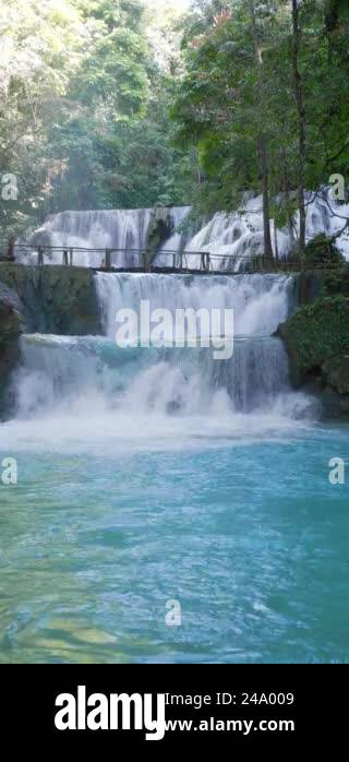 Scenic cascade waterfalls with blue water in natural pool in Central ...