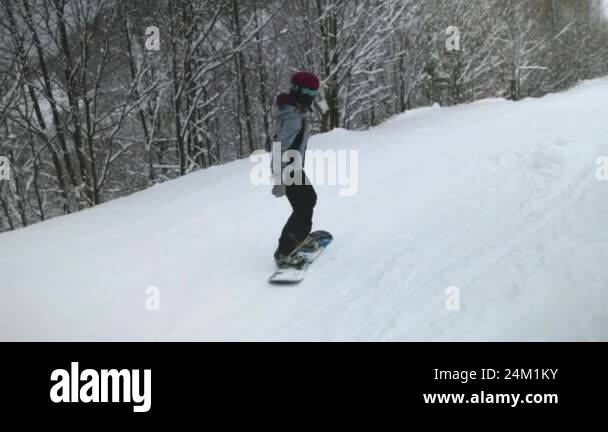 Woman riding snowboard on snow slope ski resort. Active sport ...