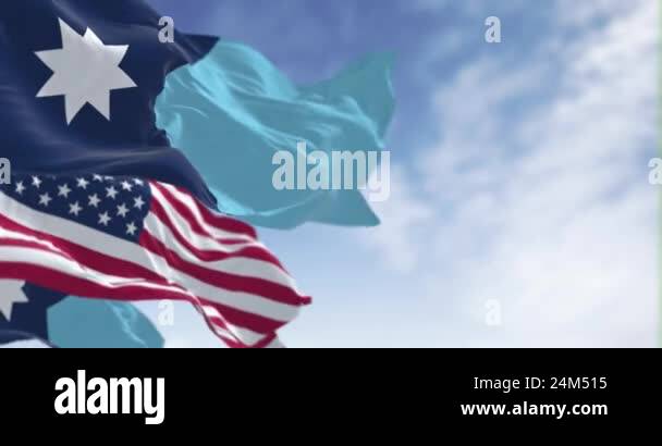 close-up of Minnesota new state flags waving with the american flag on ...