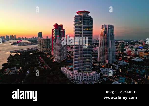 Luxury skyscraper in Miami. Miami sunset glow. City skyline in evening ...