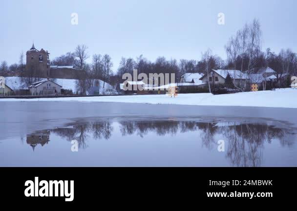 A serene winter landscape in Dobele, Latvia, featuring medieval castle ...