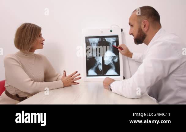 Patient Meeting, Doctor-Patient, Doctor Assessment. Doctor, dressed in ...