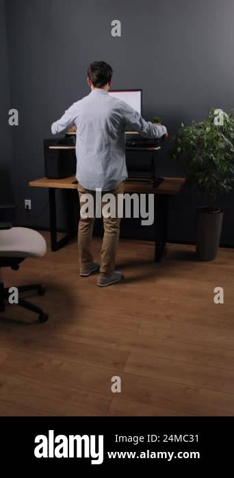 Workstation setup, Standing desk, Desk ergonomic. In modern office with ...