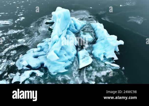 Iceberg in the ocean, Huge Chunks of Blue Glacier Ice floating on the ...