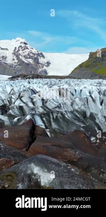Vertical Screen: Vatnajokull Glacier in Iceland. Pure blue ice, winter ...