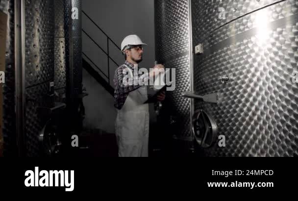 Modern winemaking facility or winery. Large steel barrels for wine ...