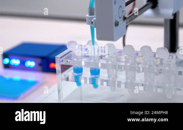 Automated pipetting of samples Stock Video Footage - Alamy