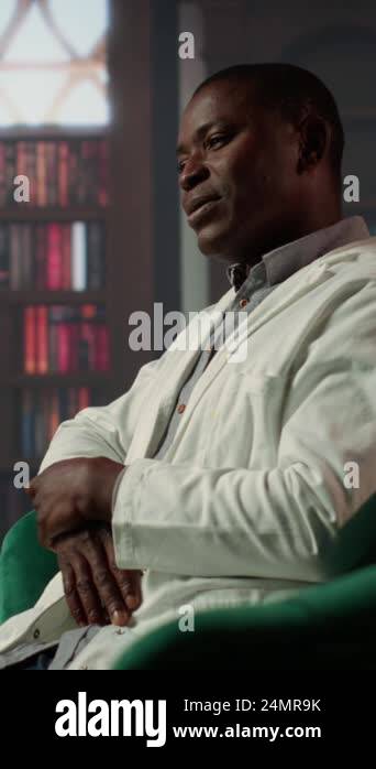 Vertical Video African american doctor surgeon sharing his PTSD issues ...