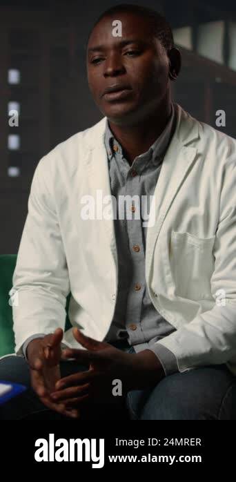 Vertical Video Professional counselor in therapy session with black ...