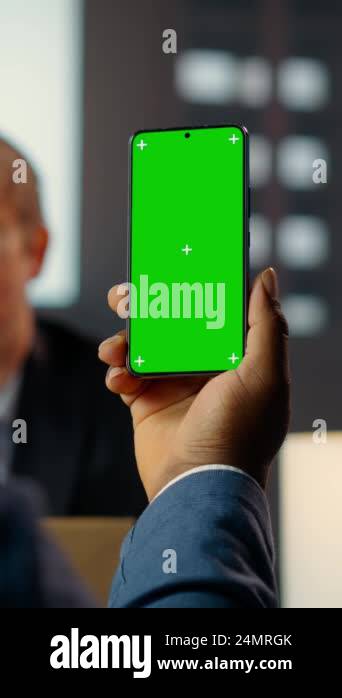 Vertical Video Diverse staff reviews documents in a wooden library at ...