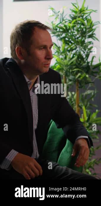 Vertical Video Upper class billionaires drinking whiskey glasses at the ...