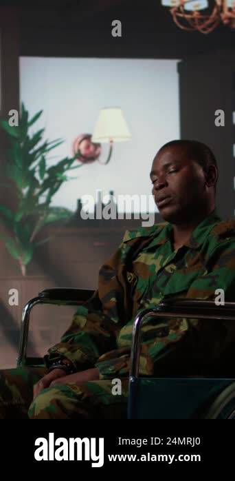 Vertical Video Black army soldier in wheelchair is a war survivor and ...