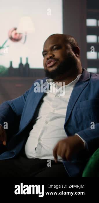 Vertical Video African american secret agent uses a secure CIA landline ...