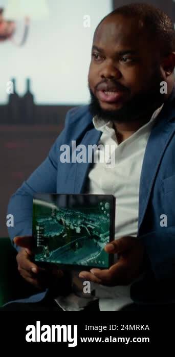 Vertical Video African american CIA expert monitoring reconnaissance ...