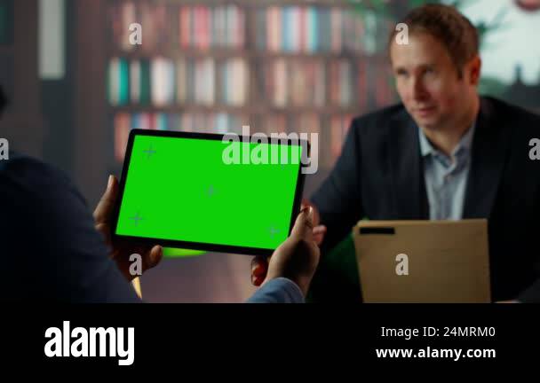 Diverse secret agents examine clues at CIA secret base with a green ...