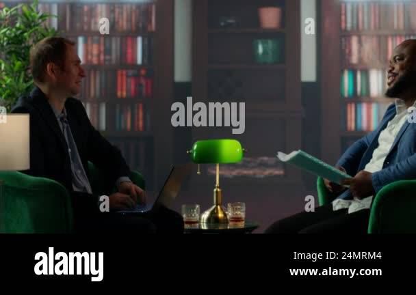 Secret service staff reviewing classified documents over whiskey ...